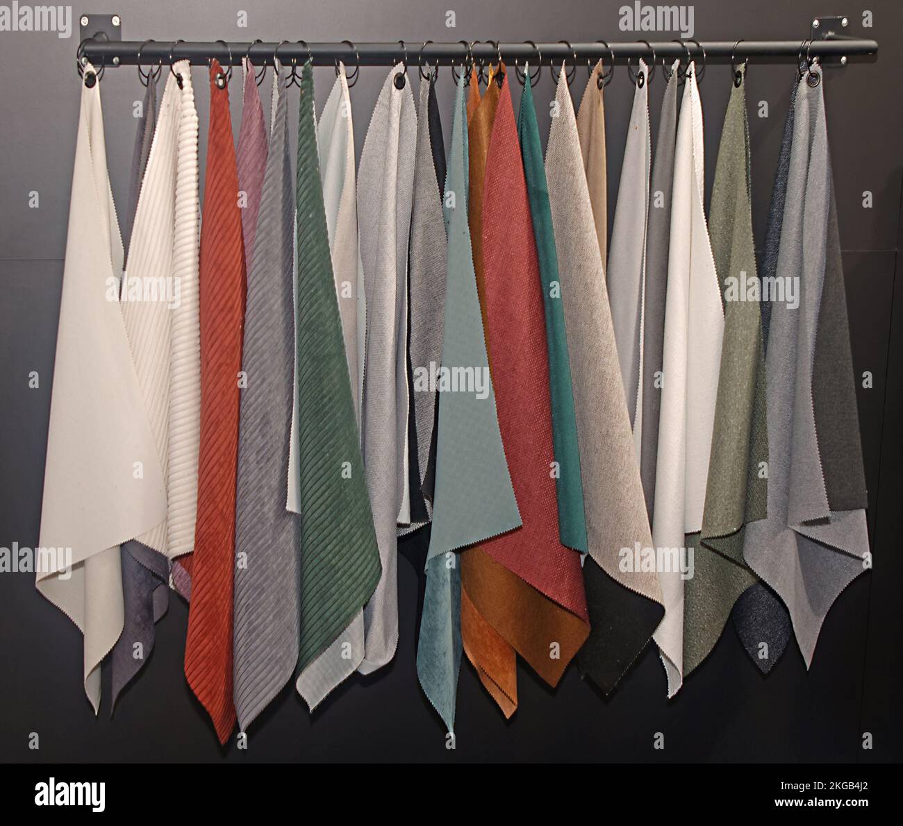 Samples of colorful materials patterns hanging on a wall Stock Photo ...
