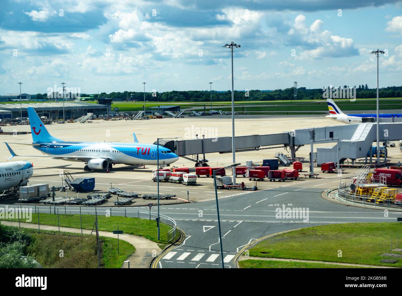 Passenger planes at Stansted Airport in the loading area and runway in ...