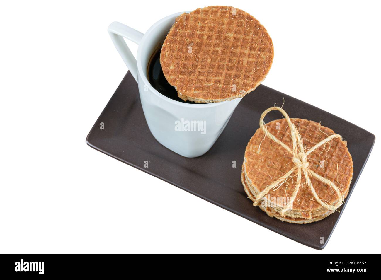 Stroopwafel cookies served with cup of coffee (top view) white ...