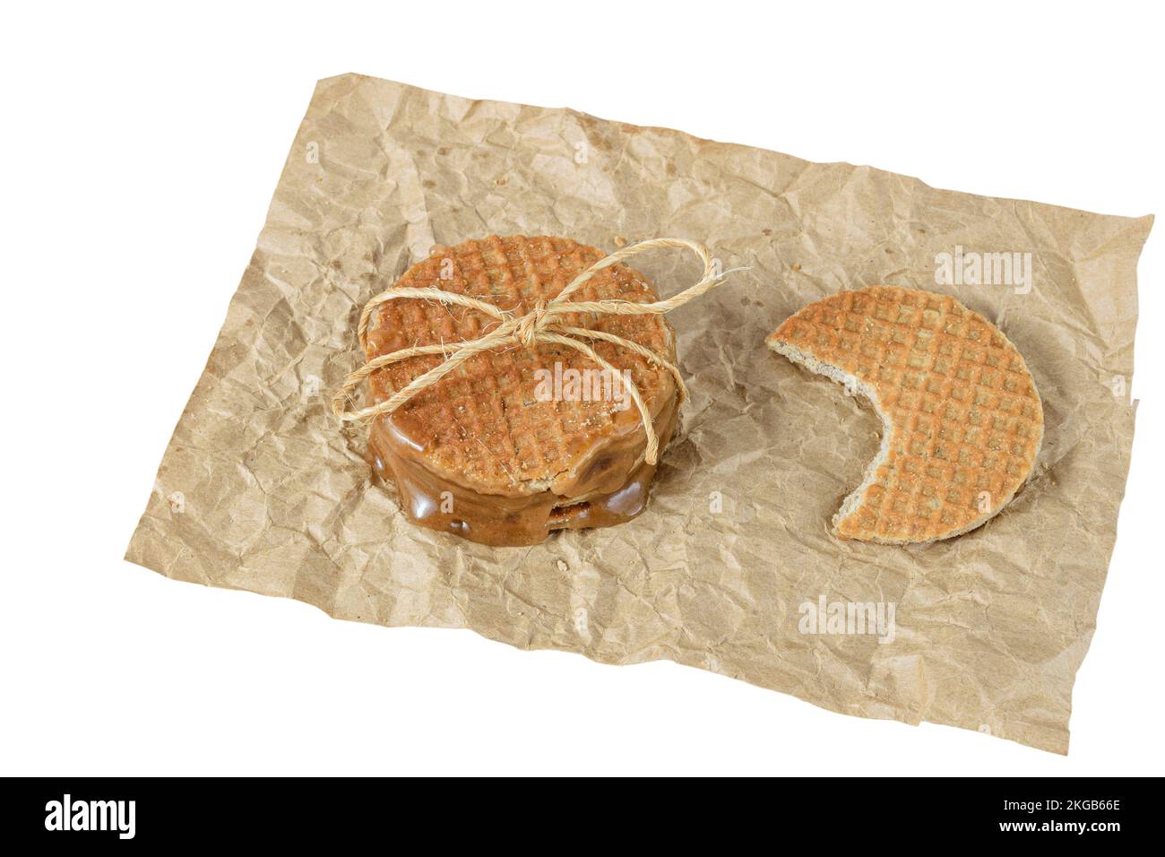 closeup of a stack of stroopwafels on a brown paper, next to another ...