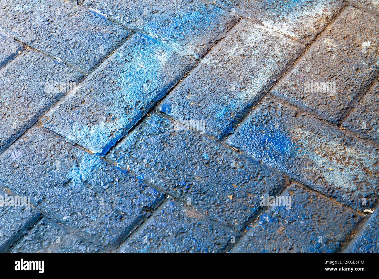 Paved floor bricks splattered with bright blue paint Stock Photo - Alamy