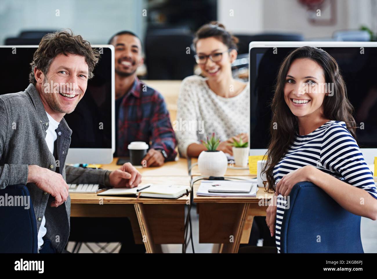 Make creativity a job. Portrait of a group of young office workers ...