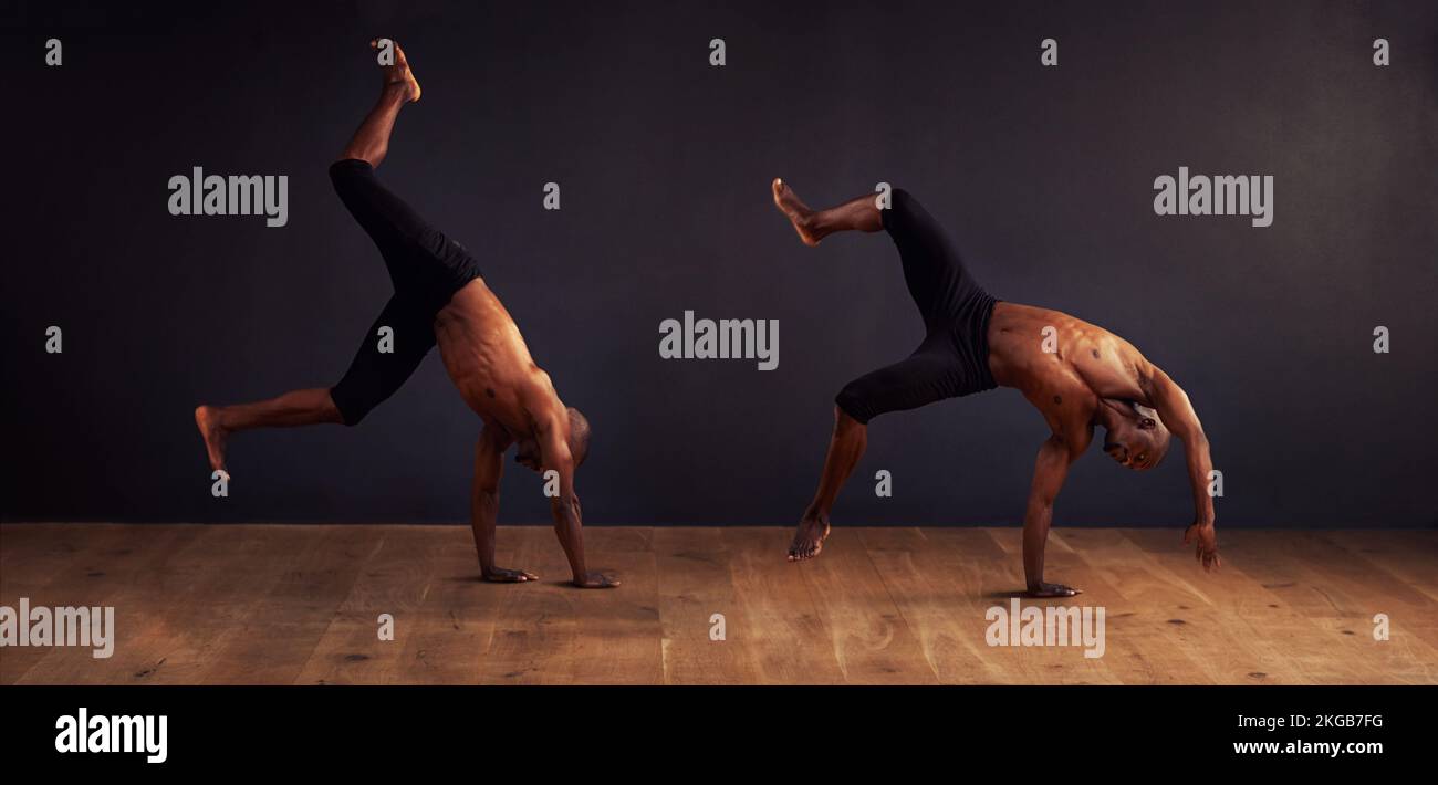 Practicing self expression. Two male contemporary dancers performing a ...