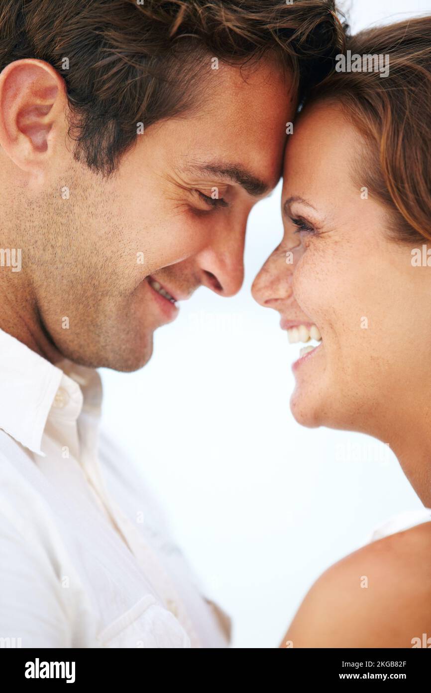 A light moment between lovers. A young couple laughing playfully as ...