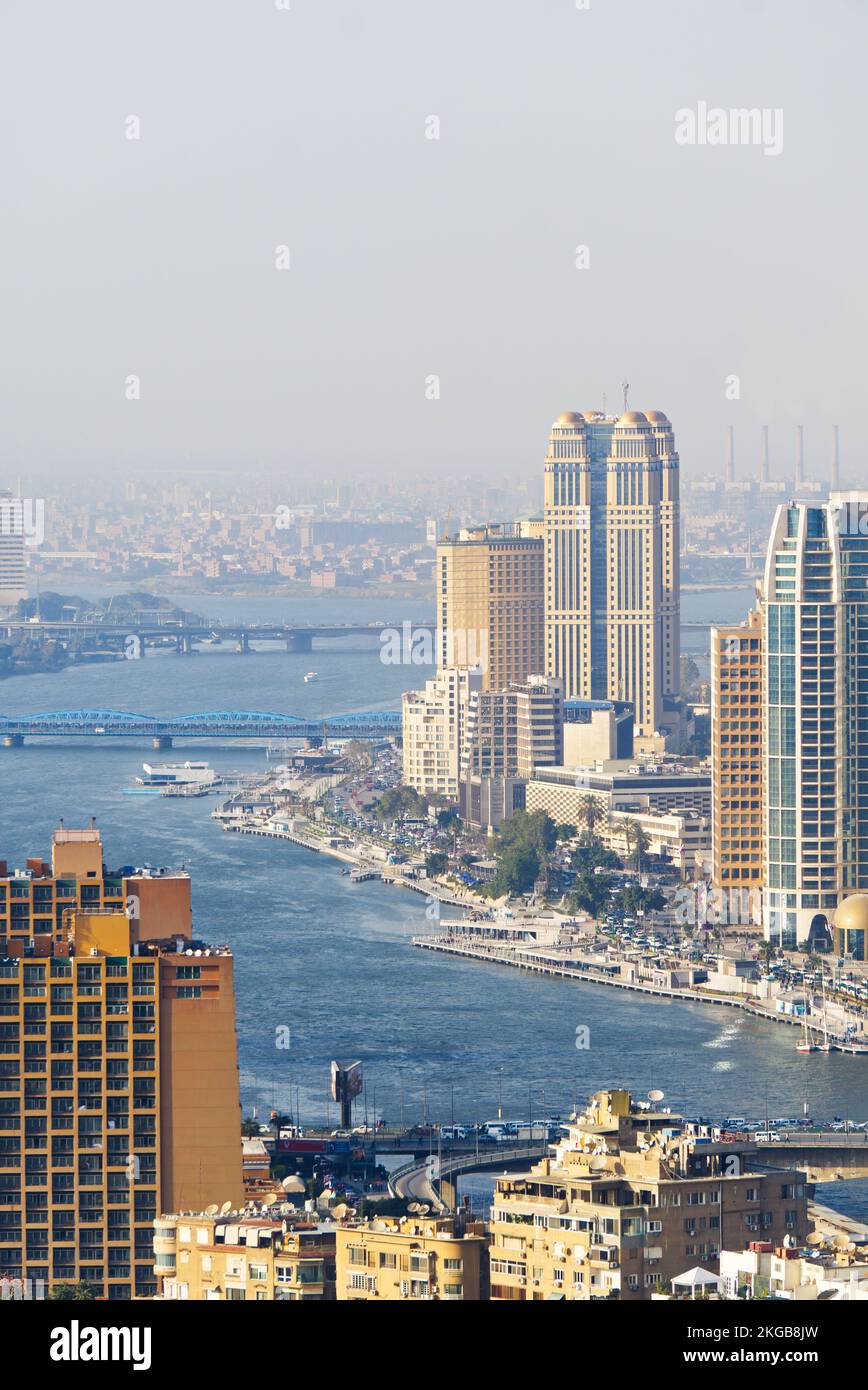 A vertical shot of the city buildings around the Nile on a sunny day in ...