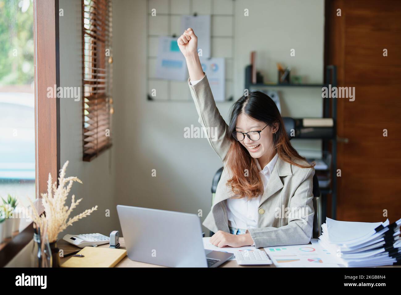 Portrait of a woman business owner showing a happy smiling face as he ...