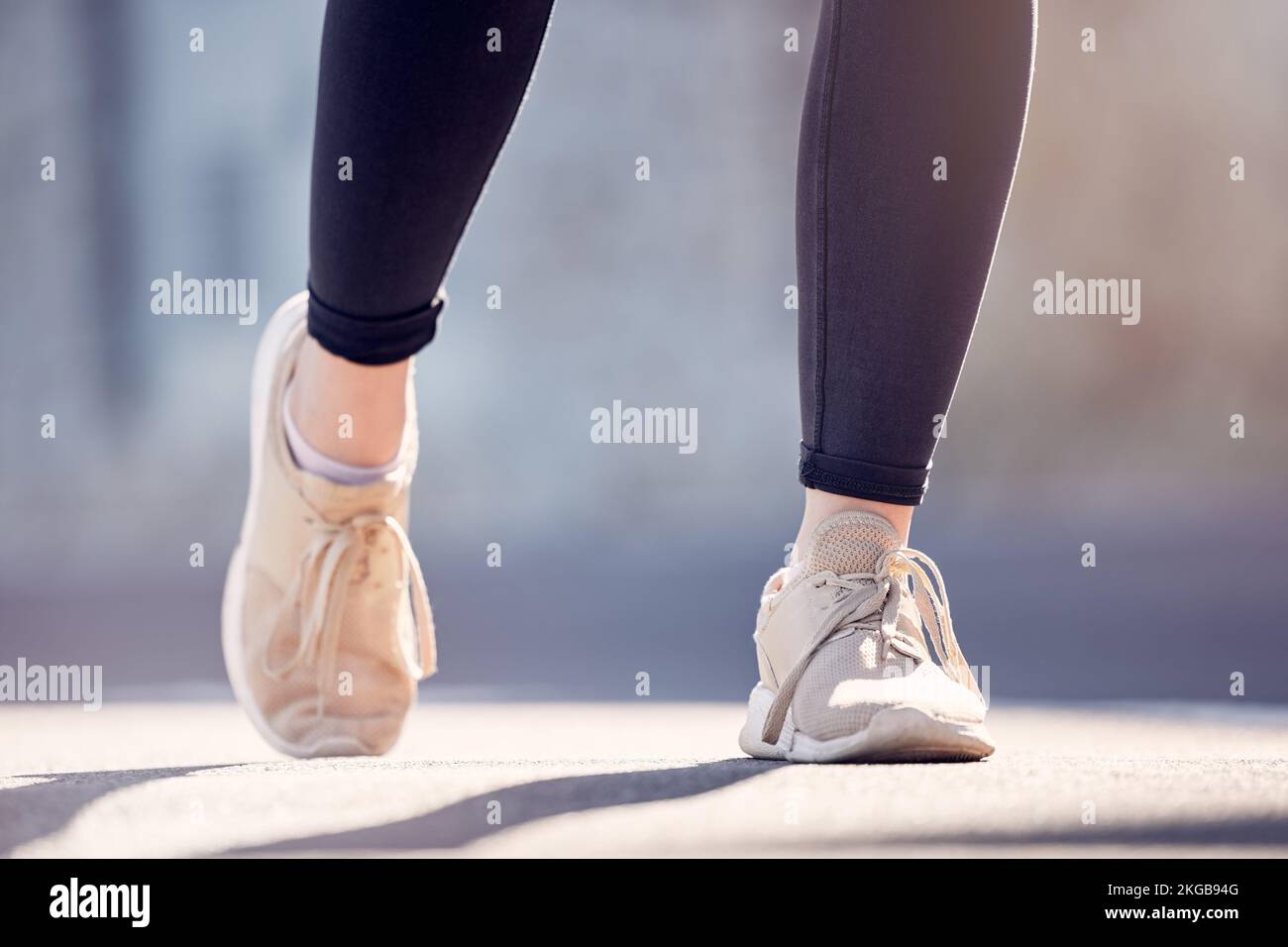 Athlete woman, running and shoes on street for fitness, workout and ...