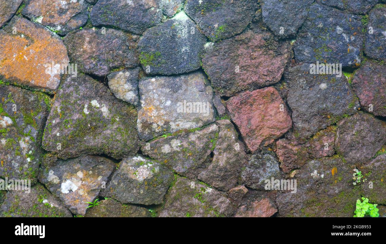 mossy stone wall as background Stock Photo - Alamy