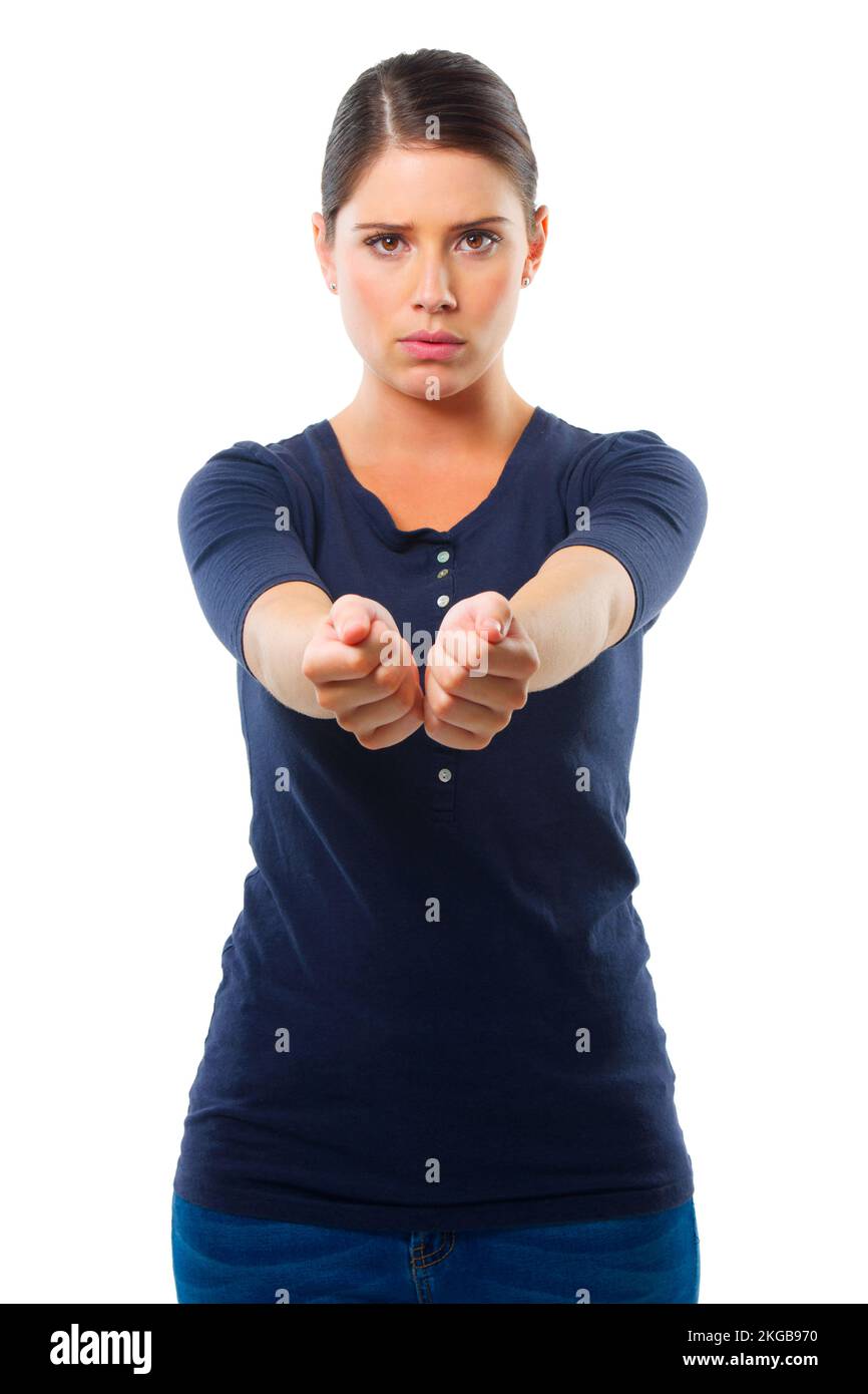 I surrender. Studio shot of a young woman holding out her arms ready to ...