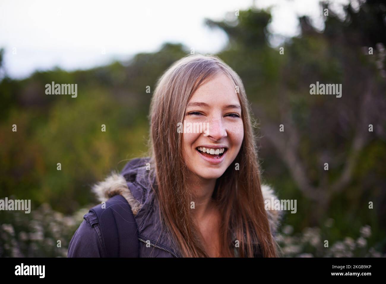 Enjoying her mountain hike. Portrait of an attractive young female ...
