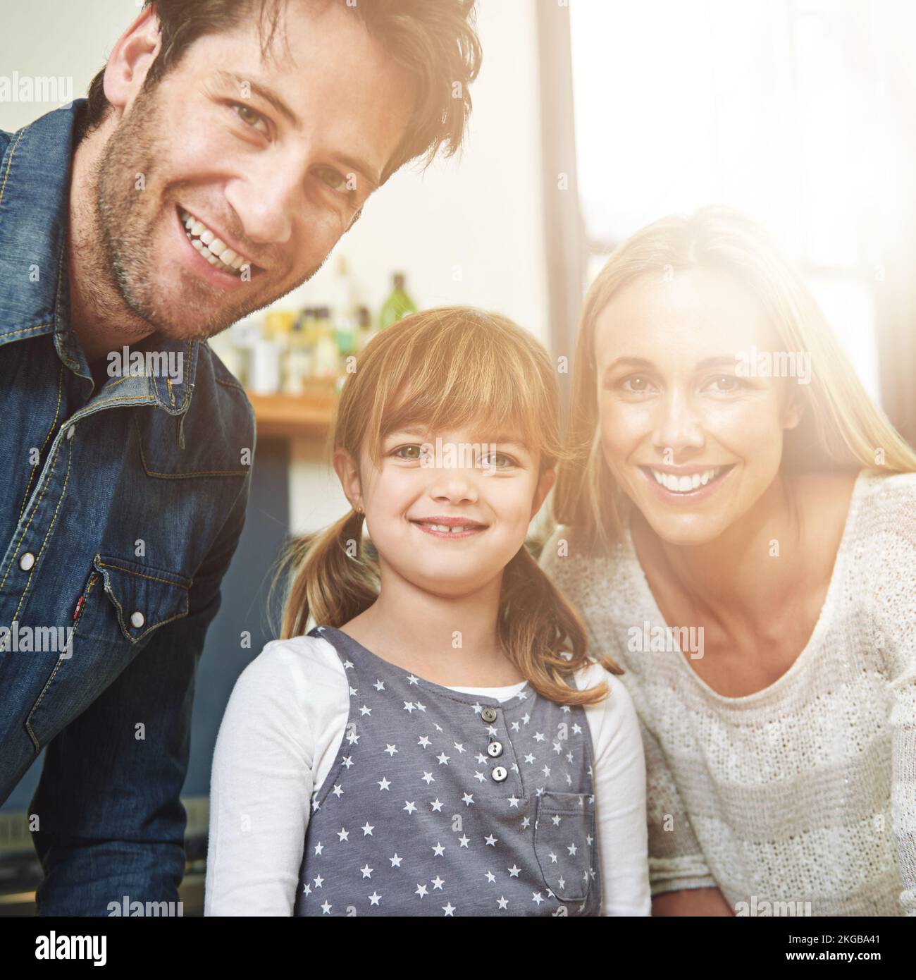 Family is a gift that lasts forever. a family enjoying pizza at home ...