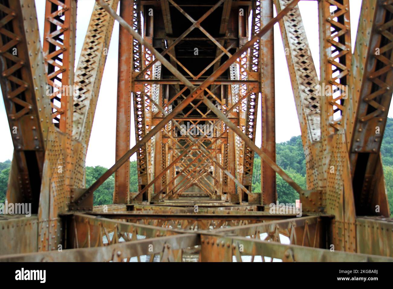 A brown metal bridge from below across the Tennessee River in Knoxville ...
