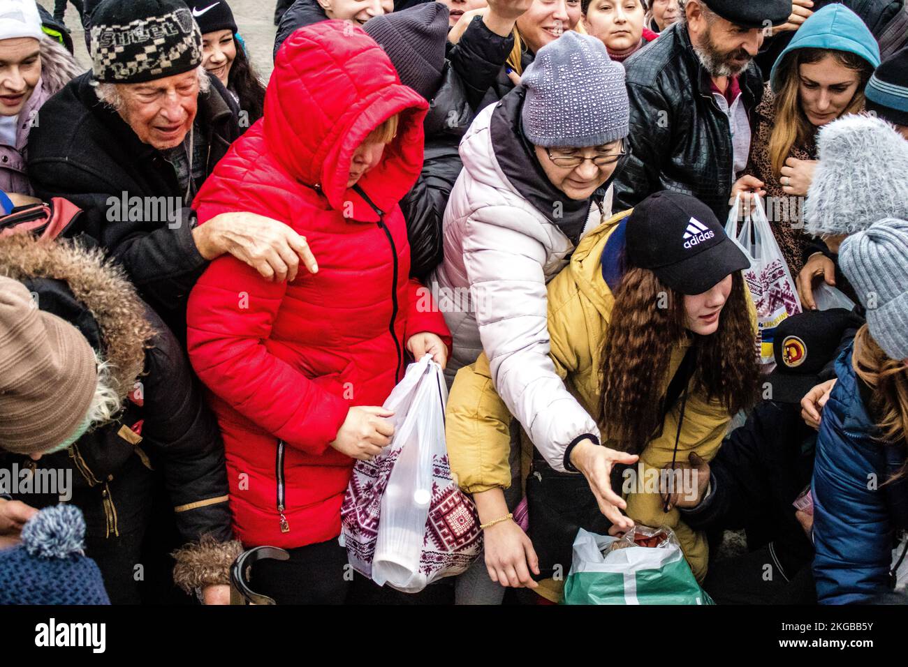 Residents of Kherson, Ukraine, receive food supplies in Freedom Square. The tension is very ...