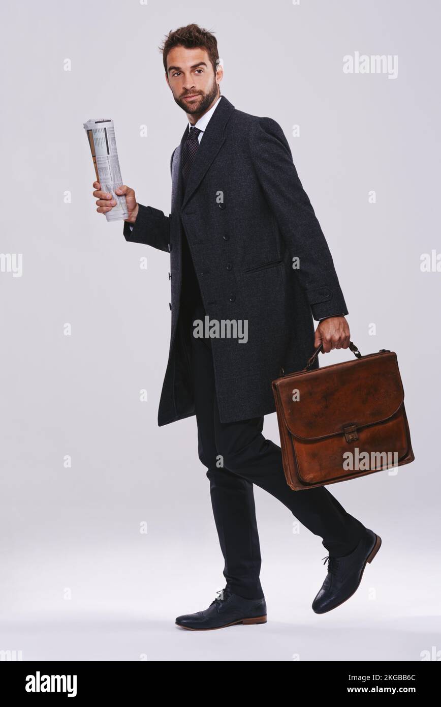 Off to work. Studio shot of a handsome and well-dressed young man Stock ...