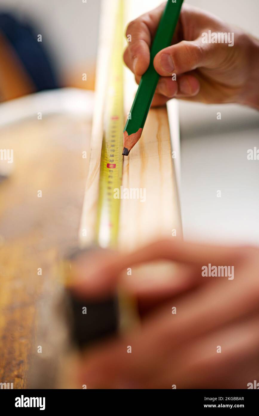 Fine workmanship is all in the details. a carpenter working with a ...