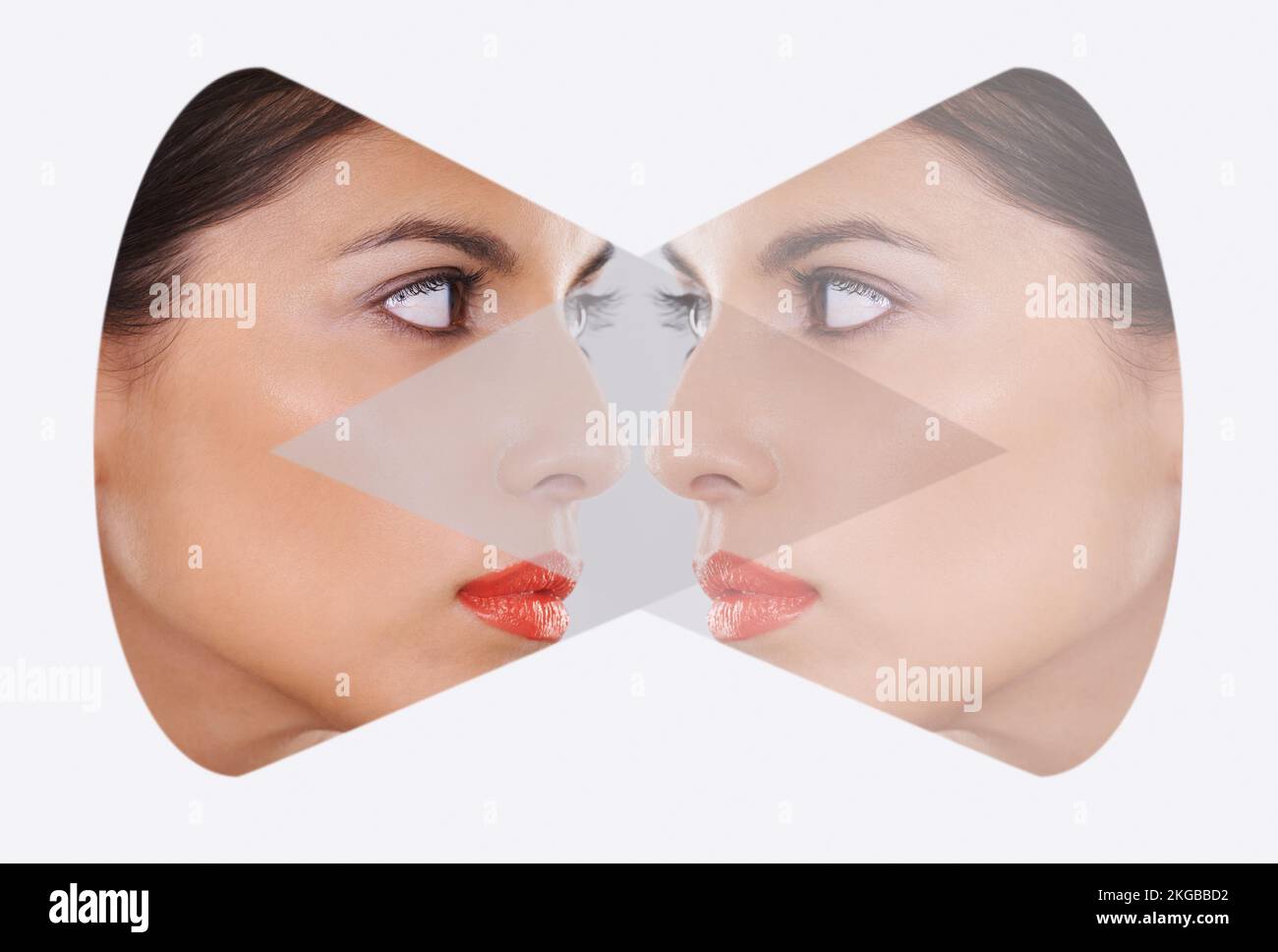 Reflection of perfection. a beautiful young woman through a cut out shape Stock Photo - Alamy