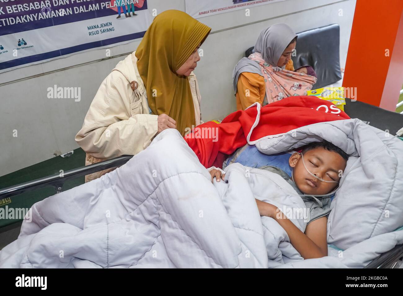 Cianjur, Indonesia. 22nd Nov, 2022. A mother takes care of her child as ...
