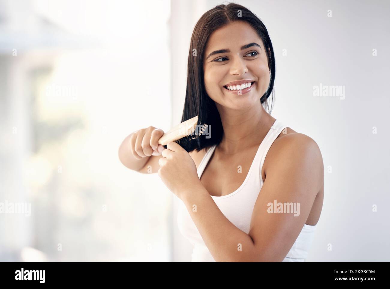 Woman, hair care and brush of a model after hair salon for beauty ...