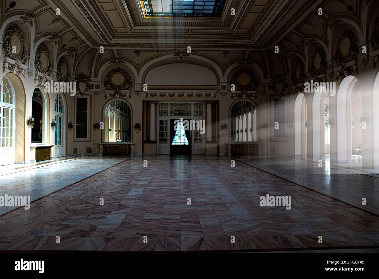 The view of sunlight entering from the window arches to an empty ...