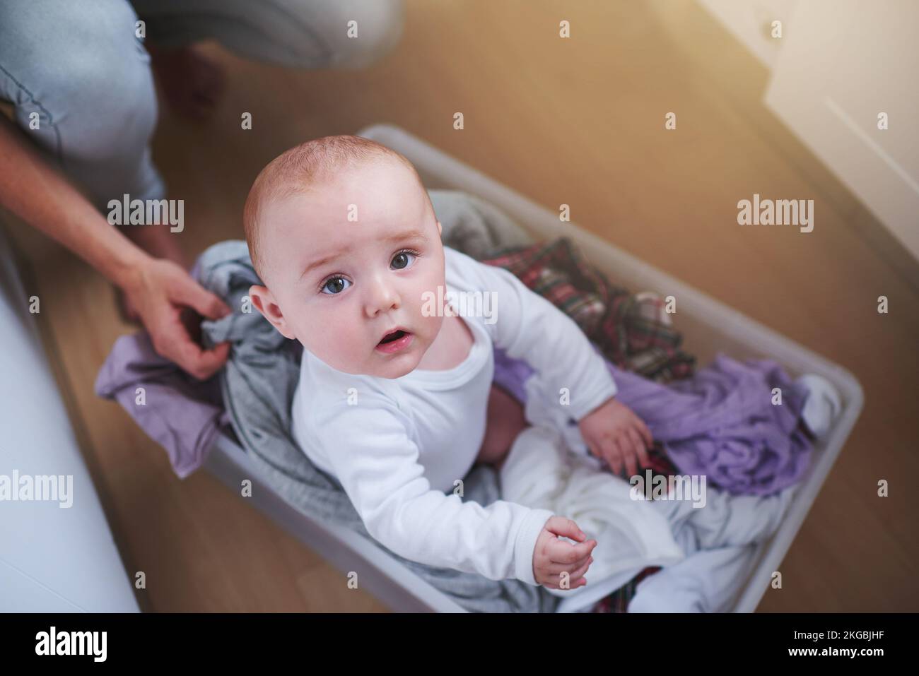 Oops Im not washing. High angle portrait of a baby girl sitting in a ...