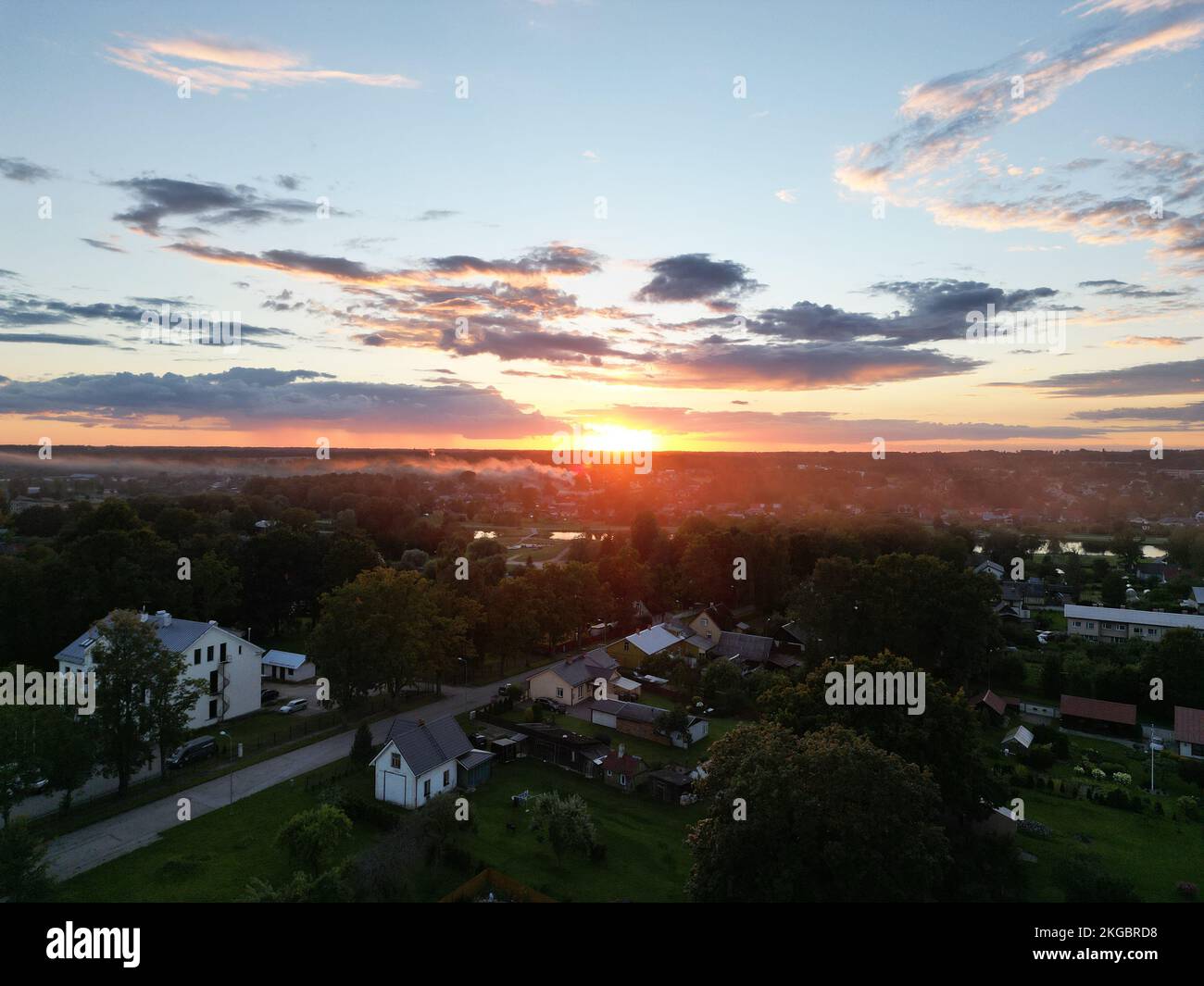An aerial of a beautiful sunset over a green landscape Stock Photo - Alamy