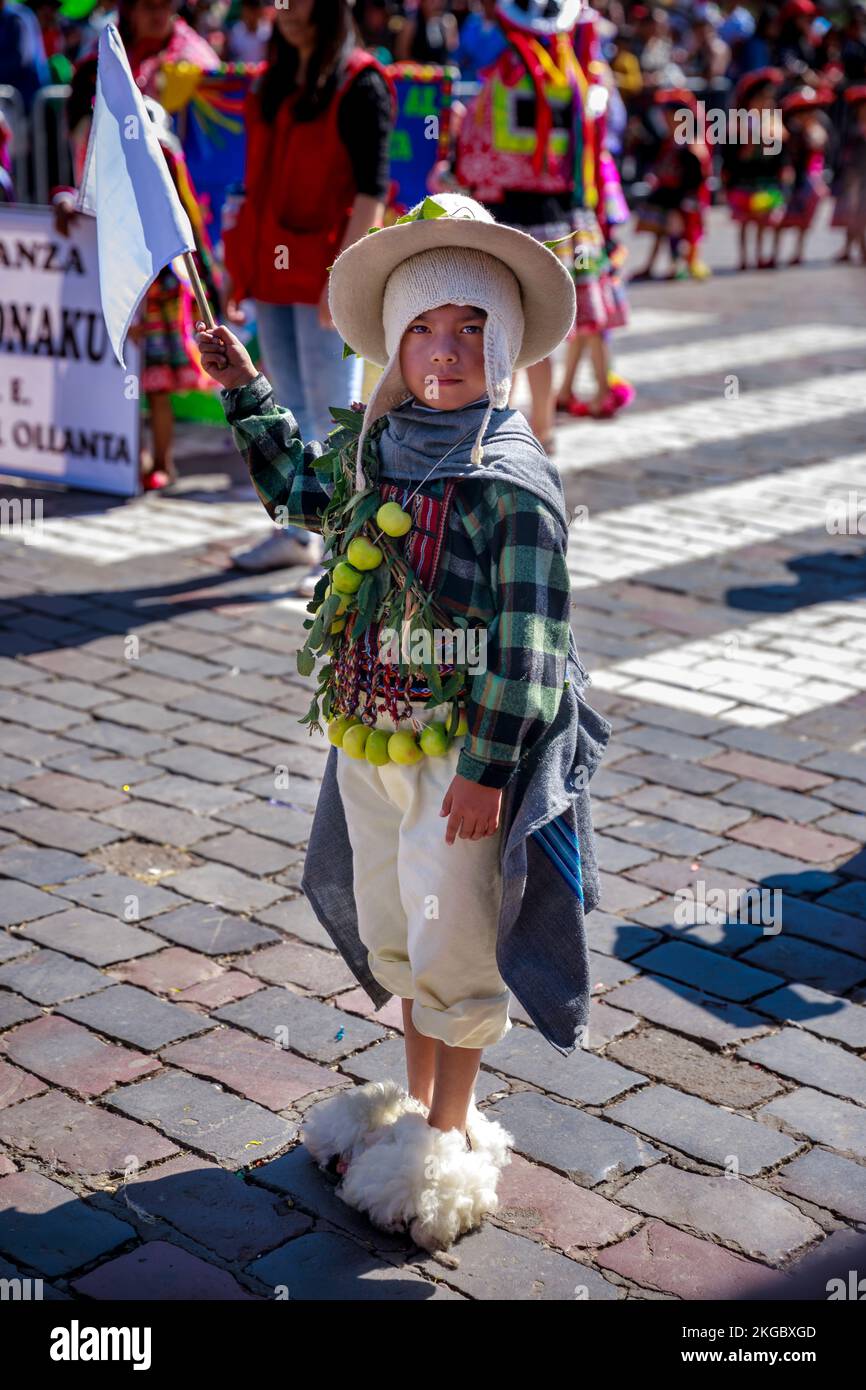 A colorfully dressed Peruvian child during a religious ceremony of Inti ...