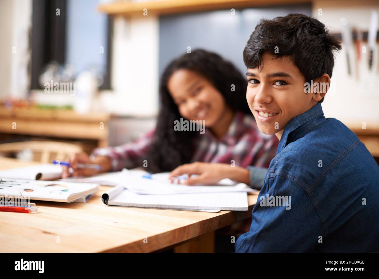 Growing through a good education. two young students studying together ...