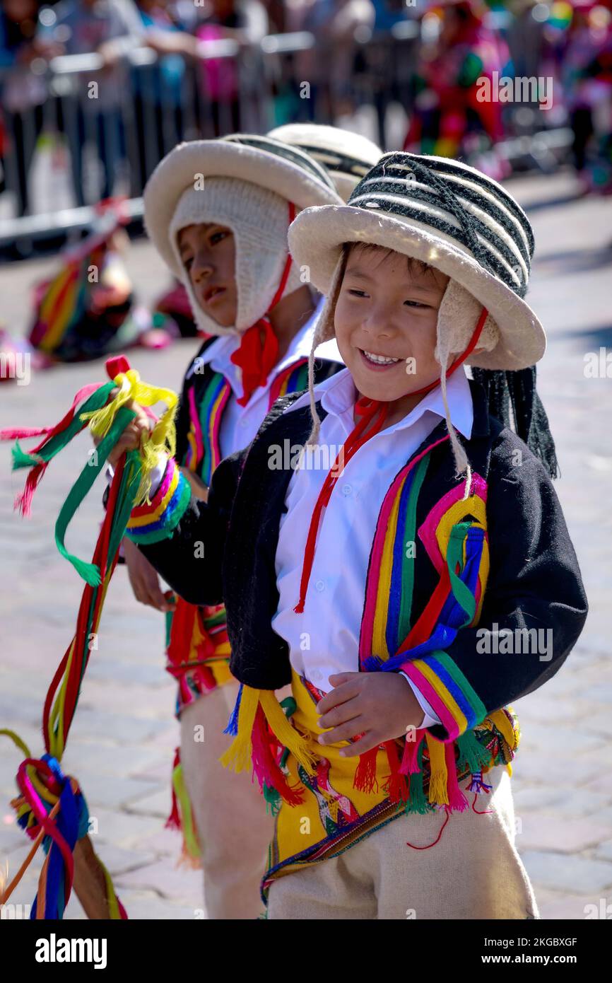 The colorfully dressed Peruvian children during a religious ceremony of ...