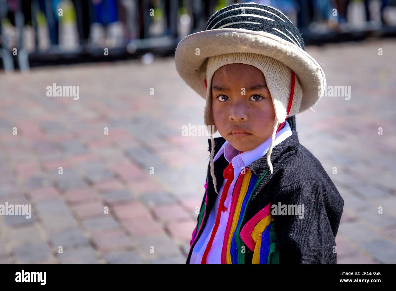 A colorfully dressed Peruvian child during a religious ceremony of Inti ...