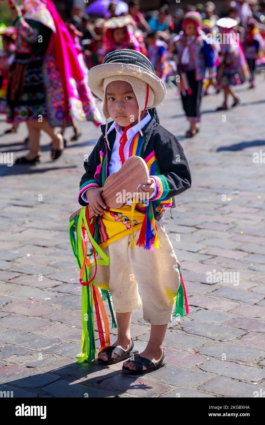 A colorfully dressed Peruvian child during a religious ceremony of Inti ...