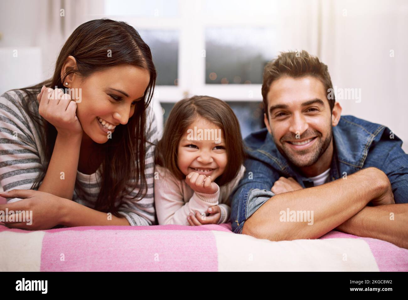 The joys of family life. Portrait of a happy family spending quality time together at home Stock ...