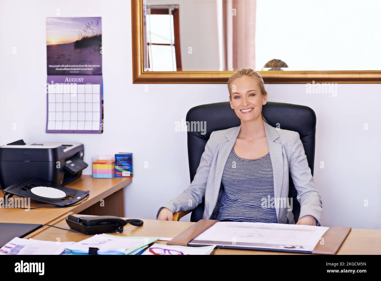 Organized and ready to go. an attractive young woman sitting at her ...