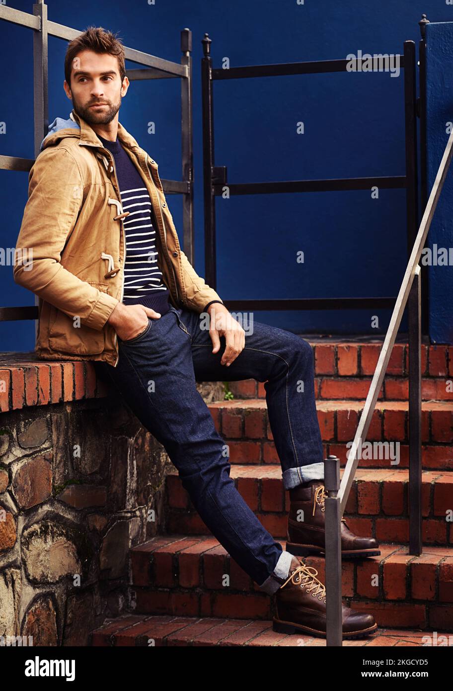 The world is your runway. A handsome young man in winter attire Stock ...