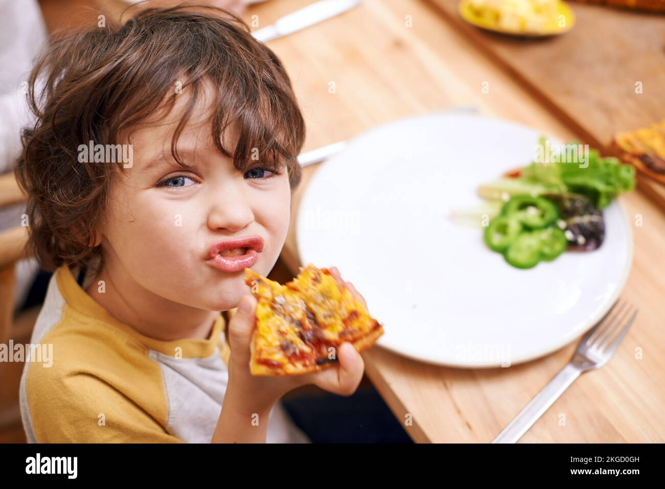 Woman boy eating dinner hi-res stock photography and images - Alamy