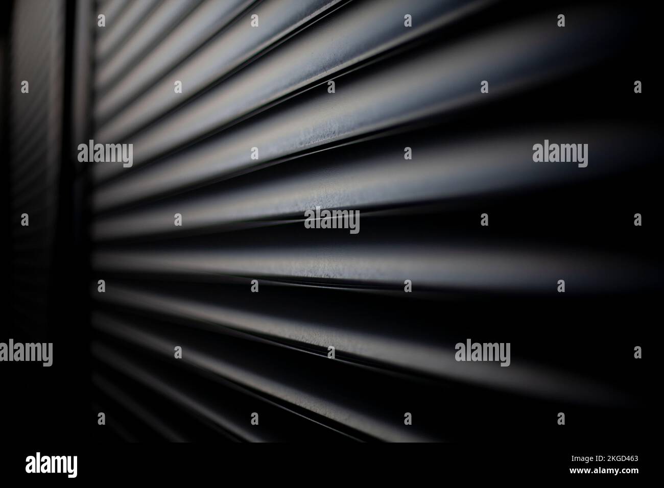 Blinds on windows of store. Steel blinds for large windows. Ribbed ...