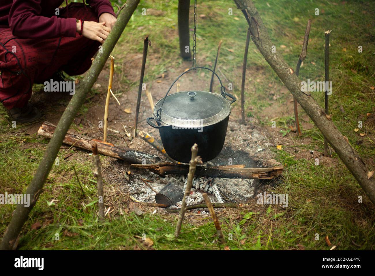 Boiler on fire. Cooking in woods. Tourist bonfire with sticks. Boiler ...