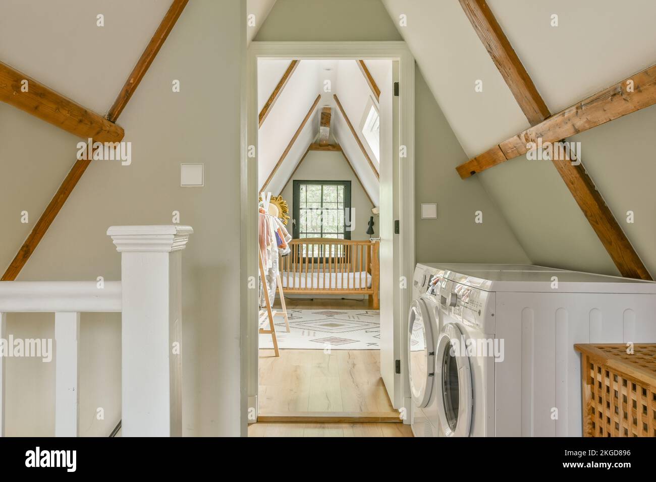 Narrow corridor with white walls and doors leading to baby room with ...