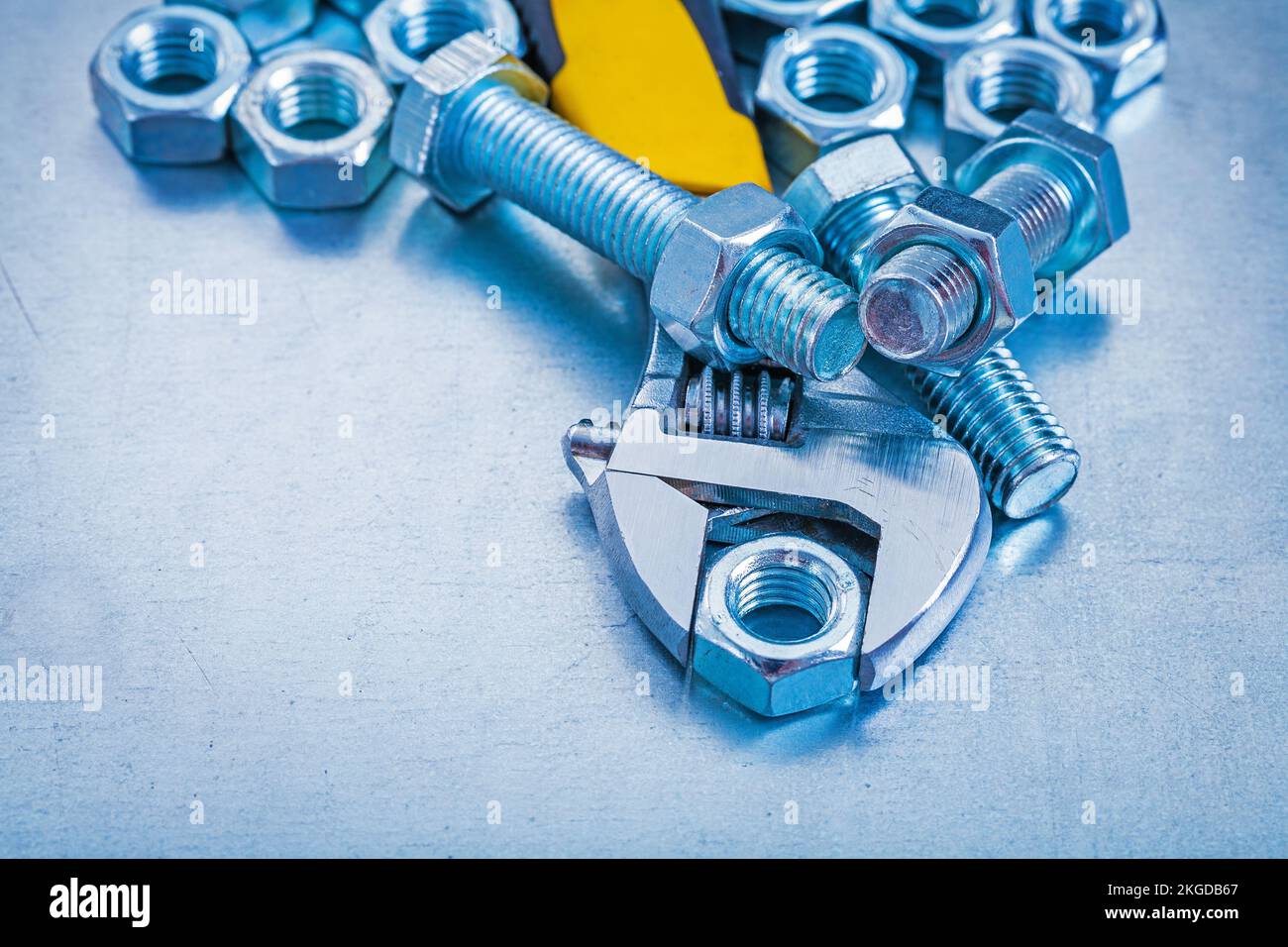 Adjustable key threaded bolt details and screw nuts on metallic ...