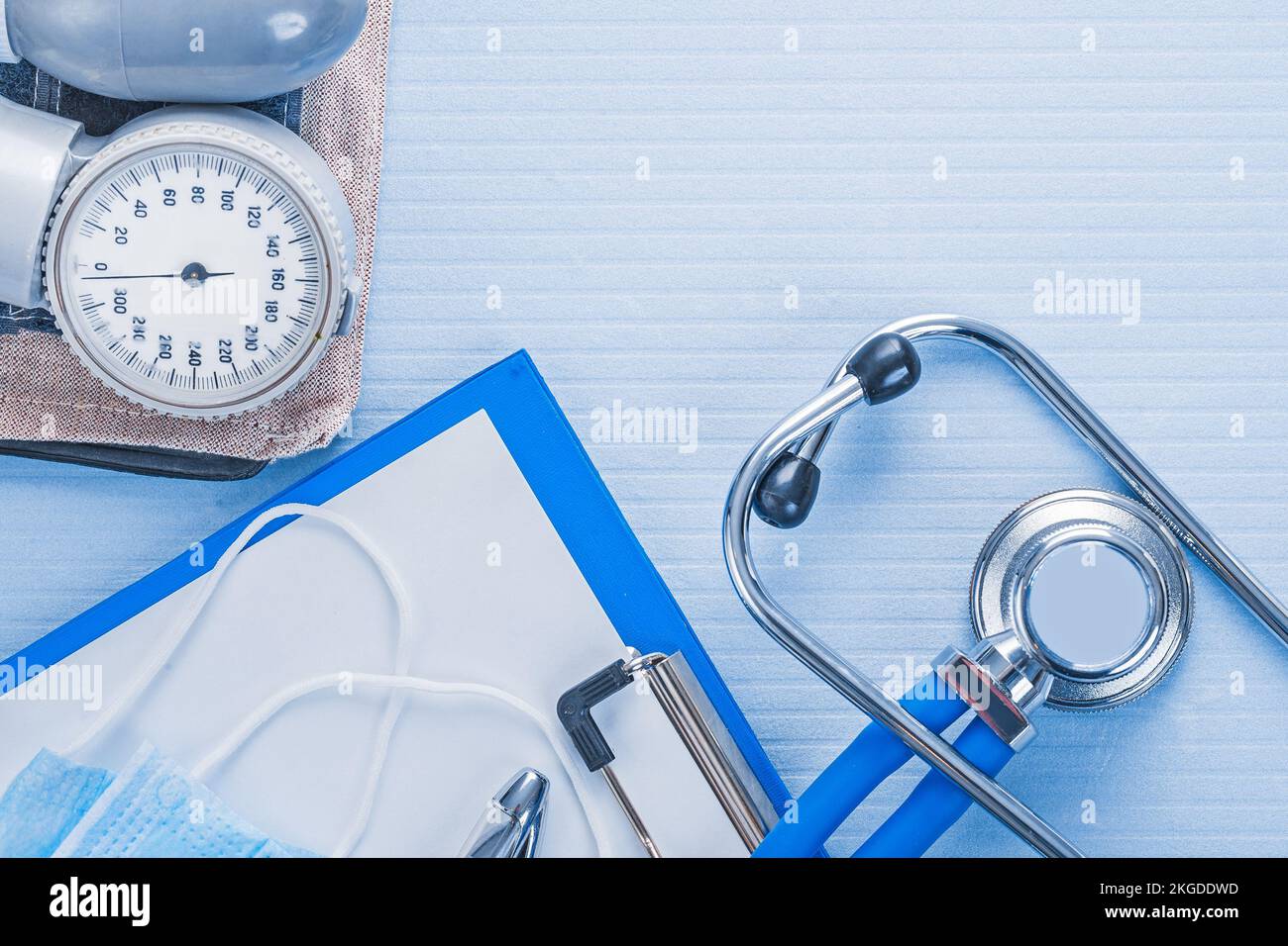 blood pressure monitor clipboard with blank sheet of paper stethoscope ...