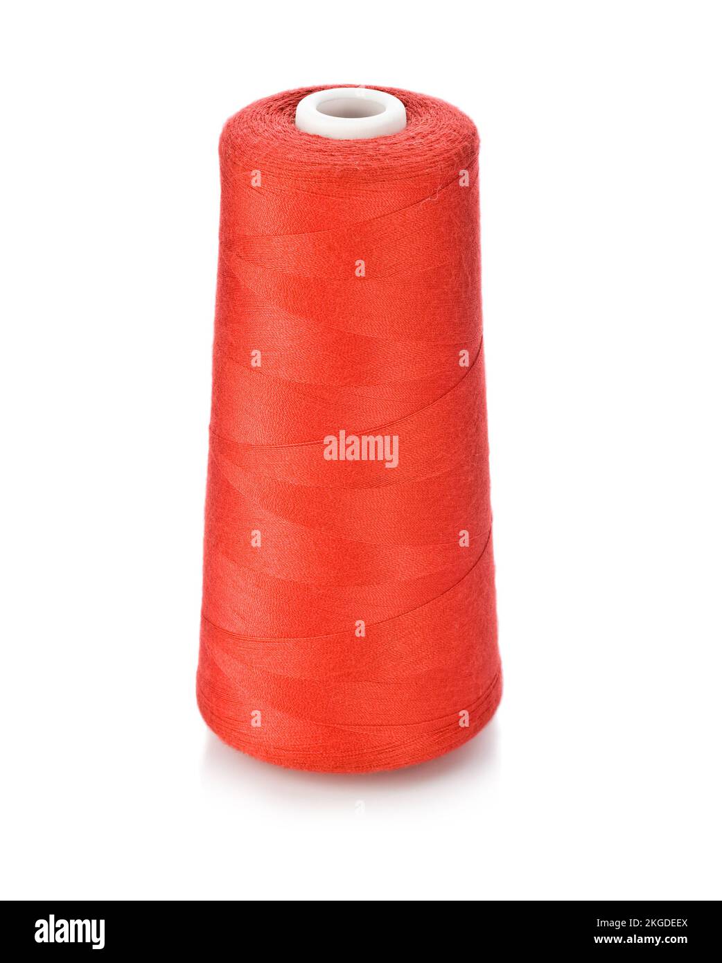 Bobbin of red thread Stock Photo - Alamy