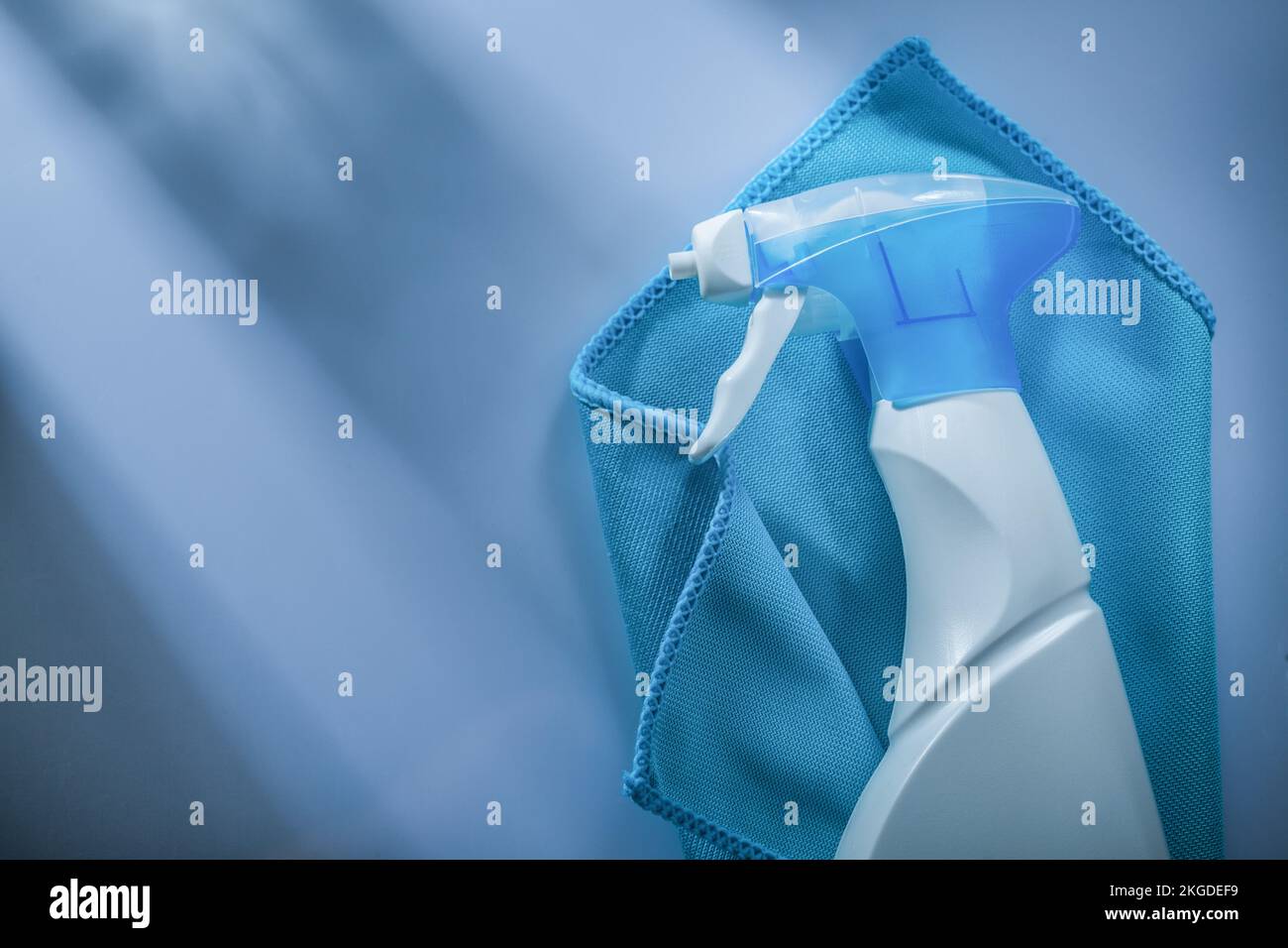 Blue washing cloth sprayer on white background Stock Photo - Alamy