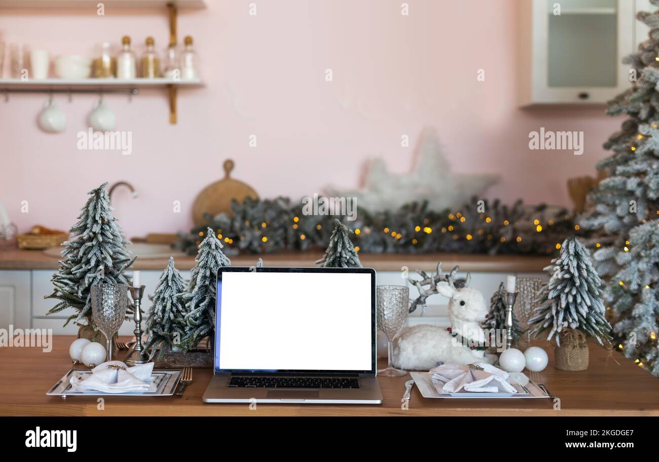 Computer laptop with blank screen in christmas tree winter backgrounds ...