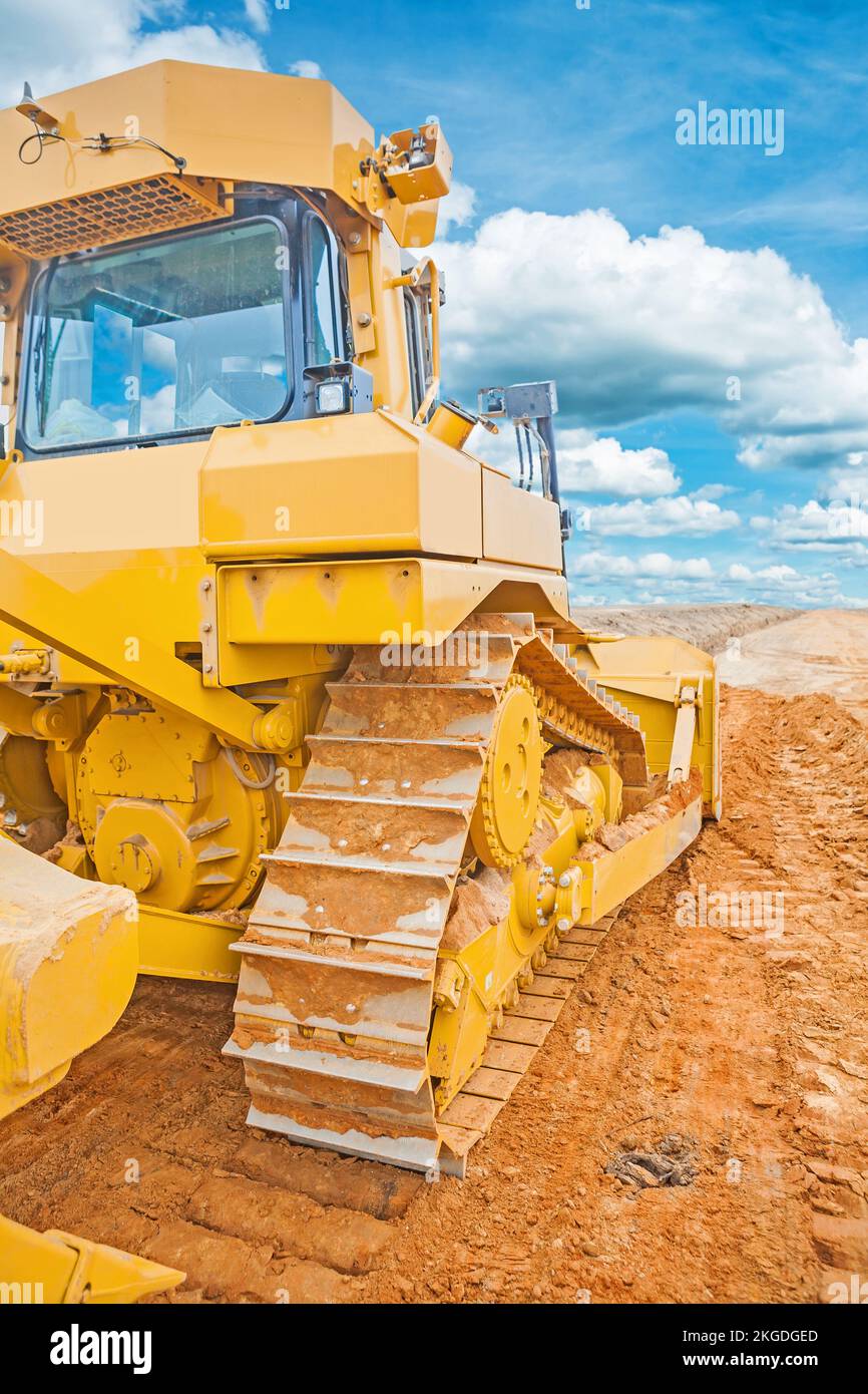 bulldozer standing on sand in construction site rear view Stock Photo ...