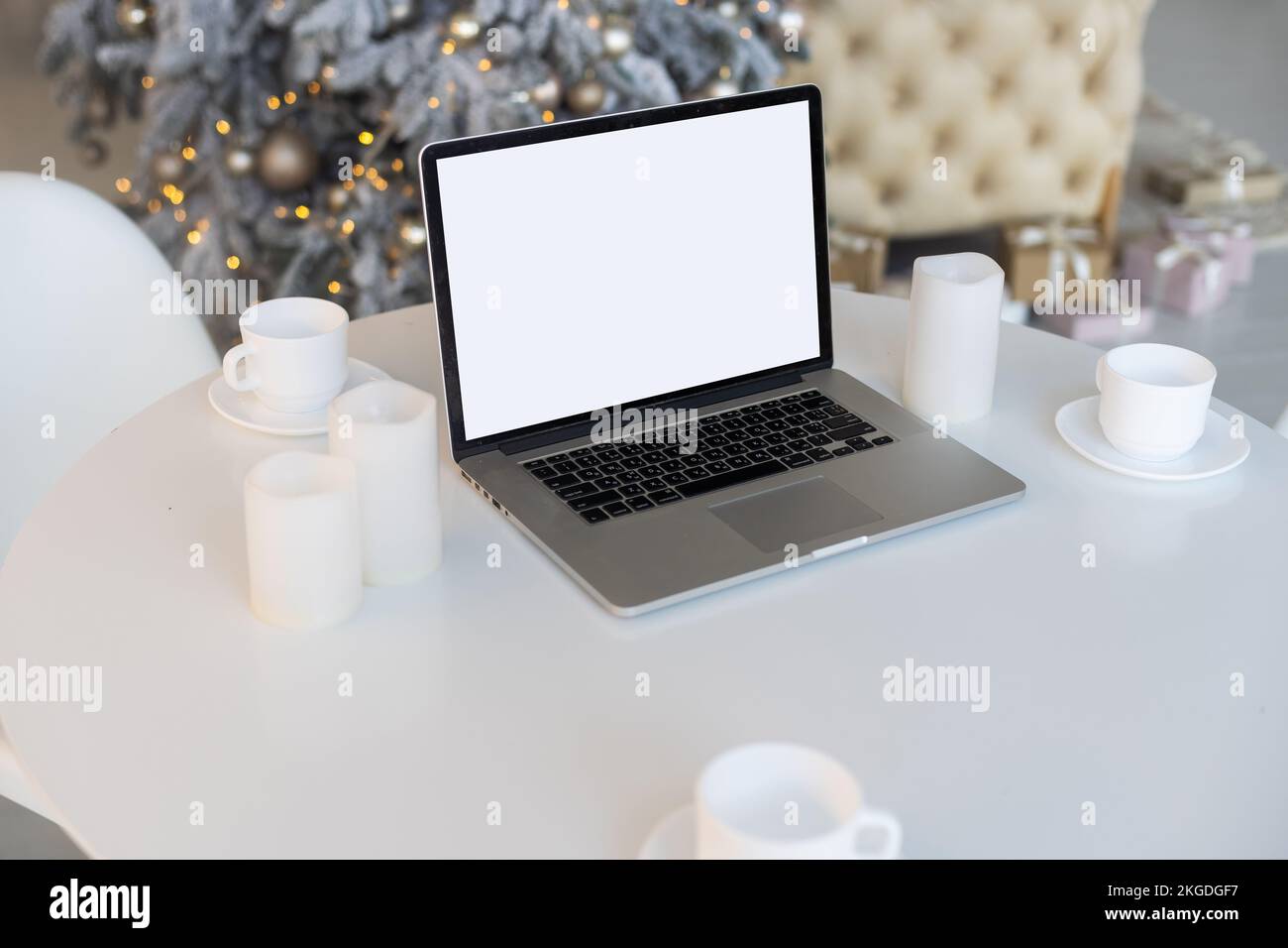 Computer laptop with blank screen in christmas tree winter backgrounds ...