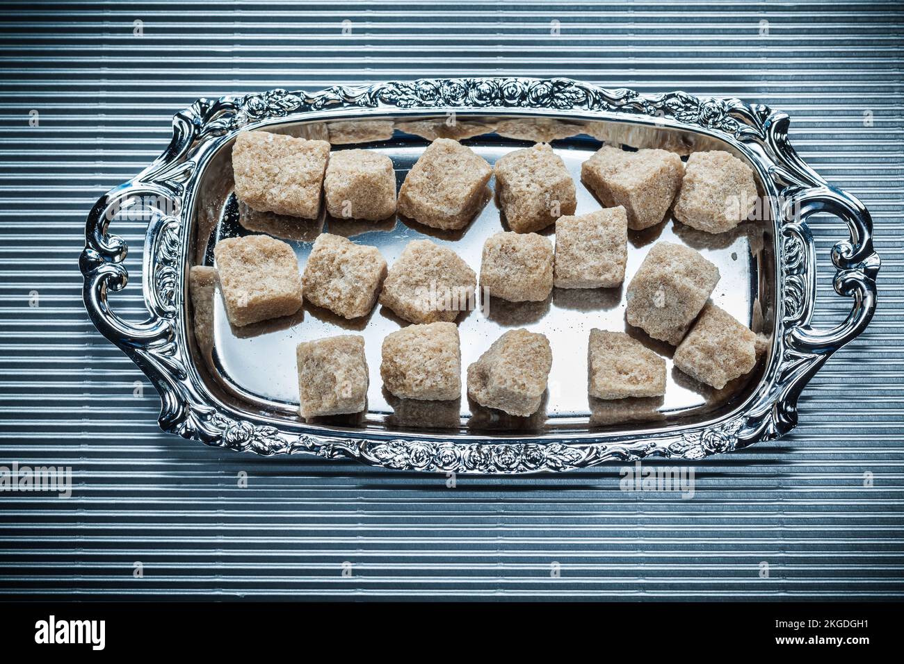 Brown sugar tray on striped background Stock Photo - Alamy