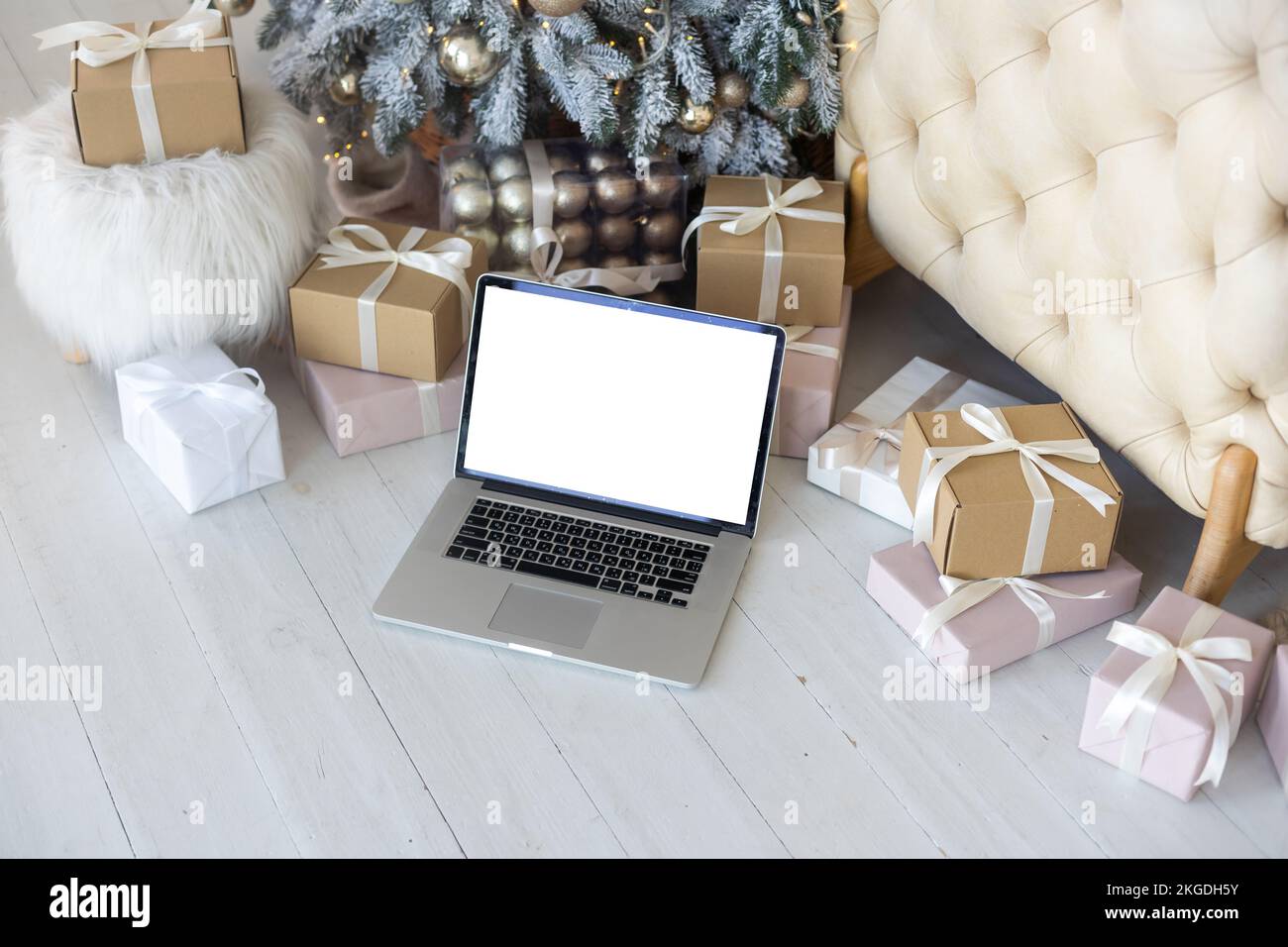 Computer laptop with blank screen in christmas tree winter backgrounds ...