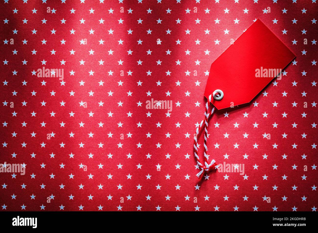 Cardboard price tag on red tablecloth Stock Photo - Alamy