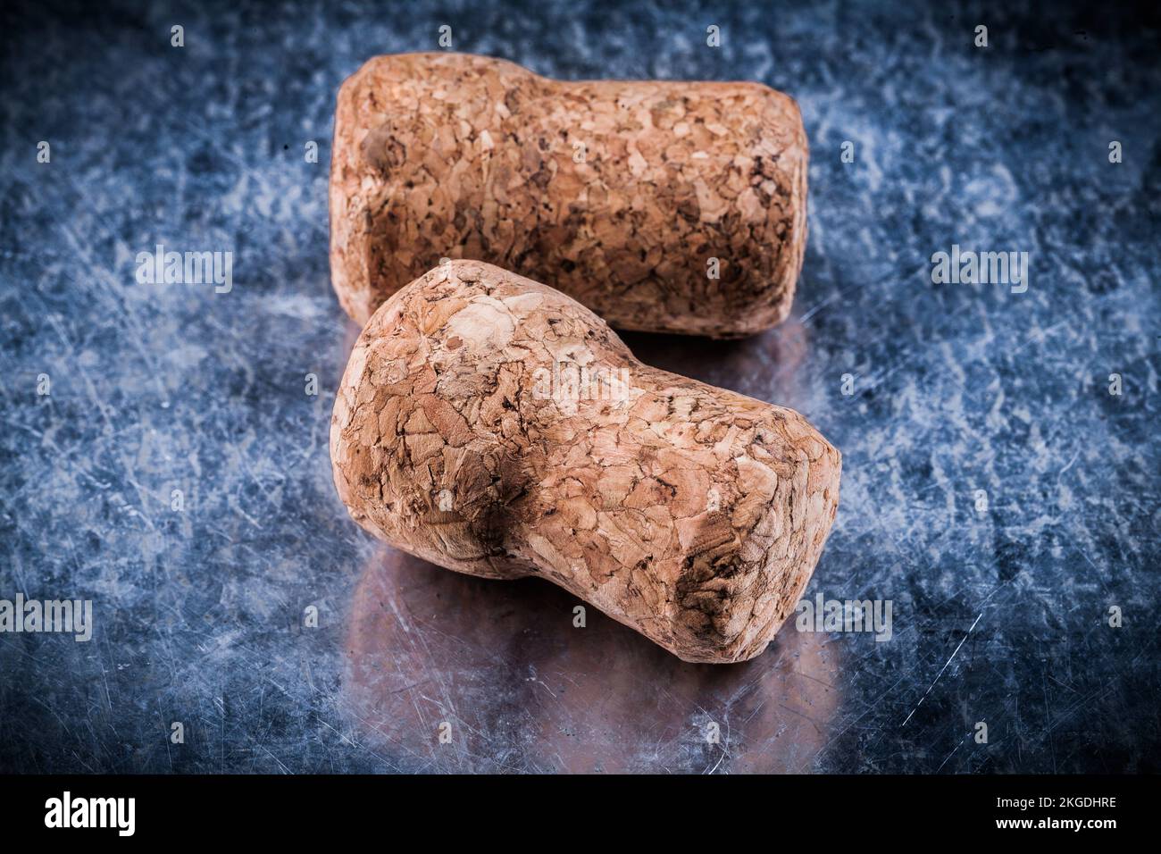 Champagne corks on scratched metallic background food and drink concept ...