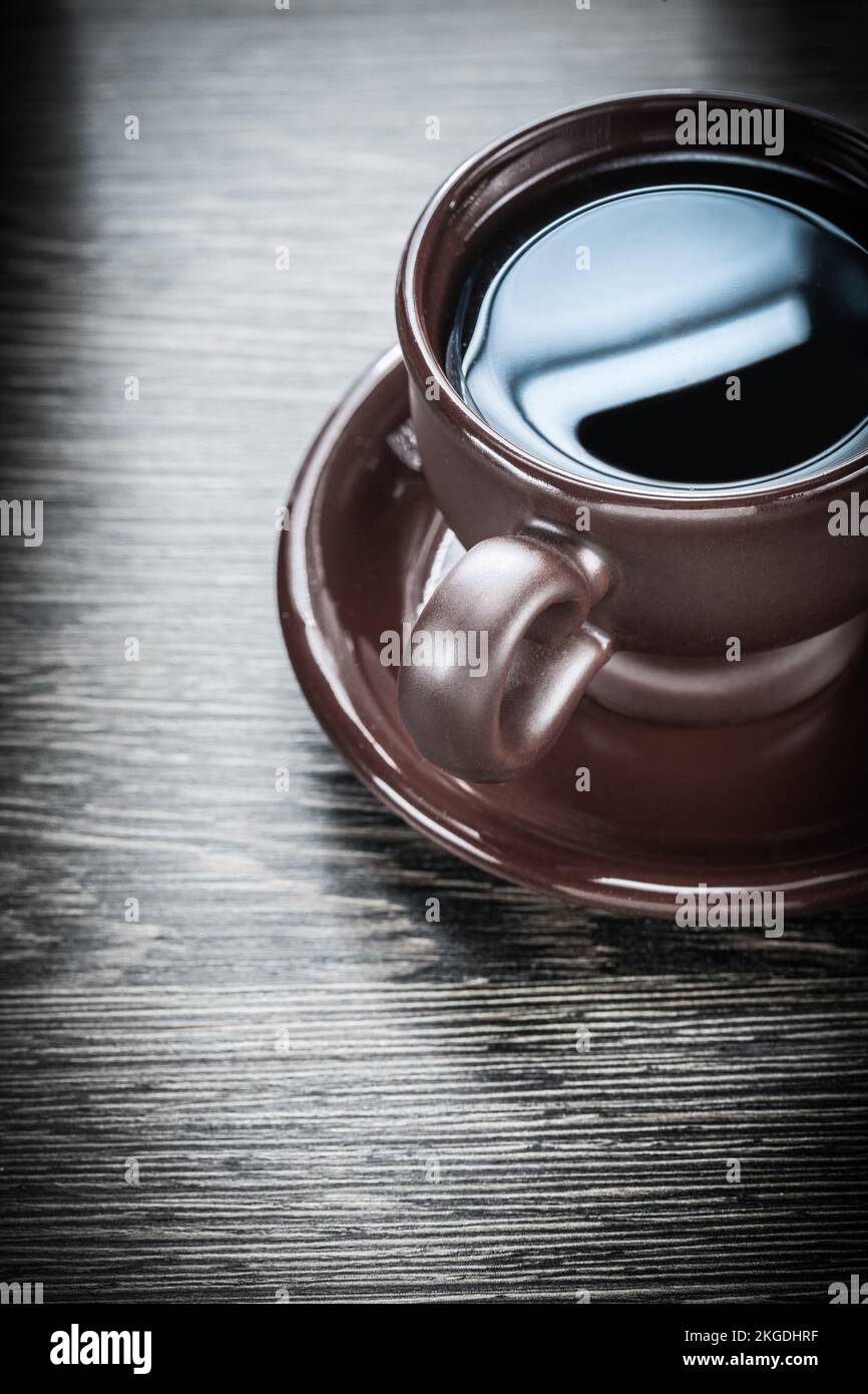 Ceramic cup of strong coffee saucer on wooden board Stock Photo - Alamy