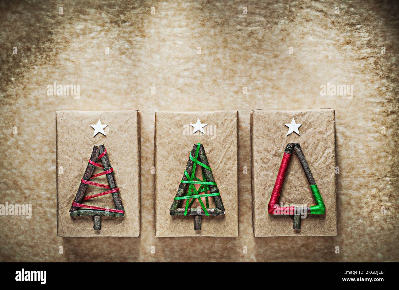 Christmas gift boxes on crumpled vintage paper Stock Photo - Alamy